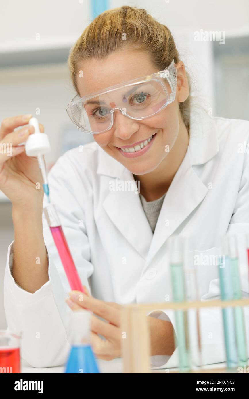 Girl holding pipette in hi-res stock photography and images - Alamy