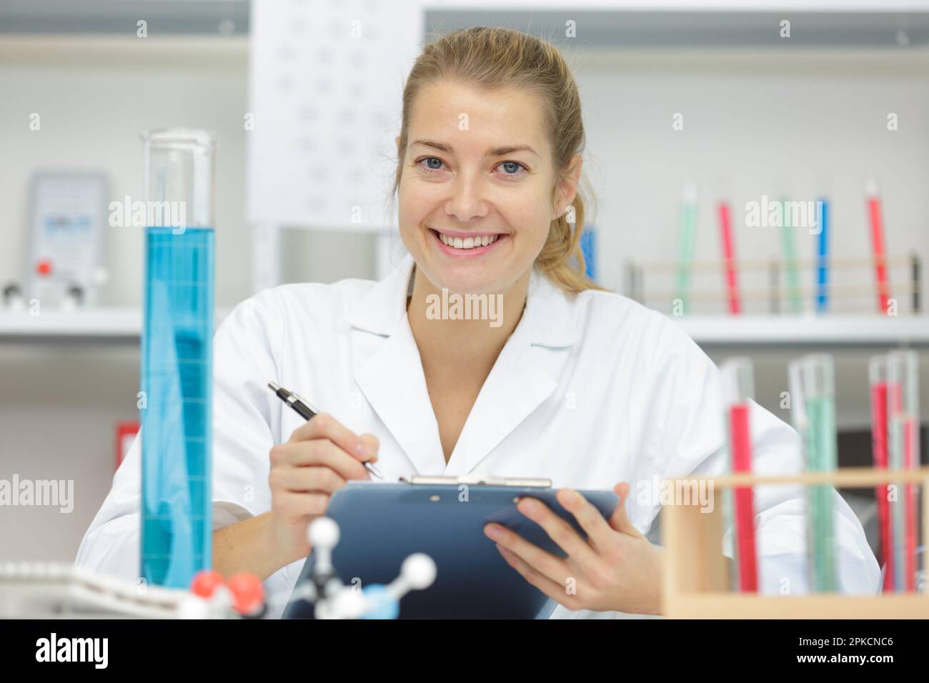 attractive young female lab technician Stock Photo - Alamy