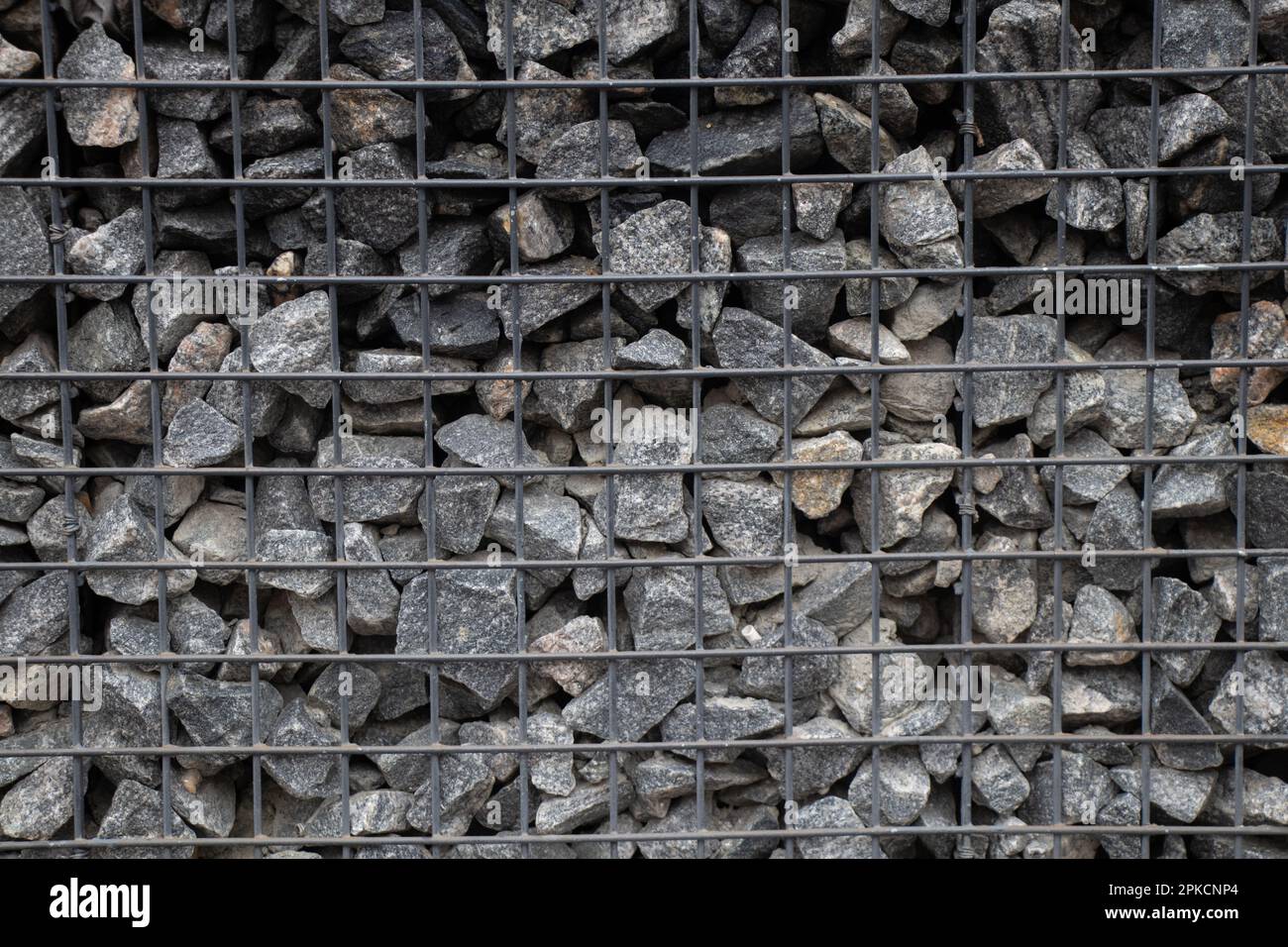 stone fence gabion close up daytime outdoors Stock Photo - Alamy