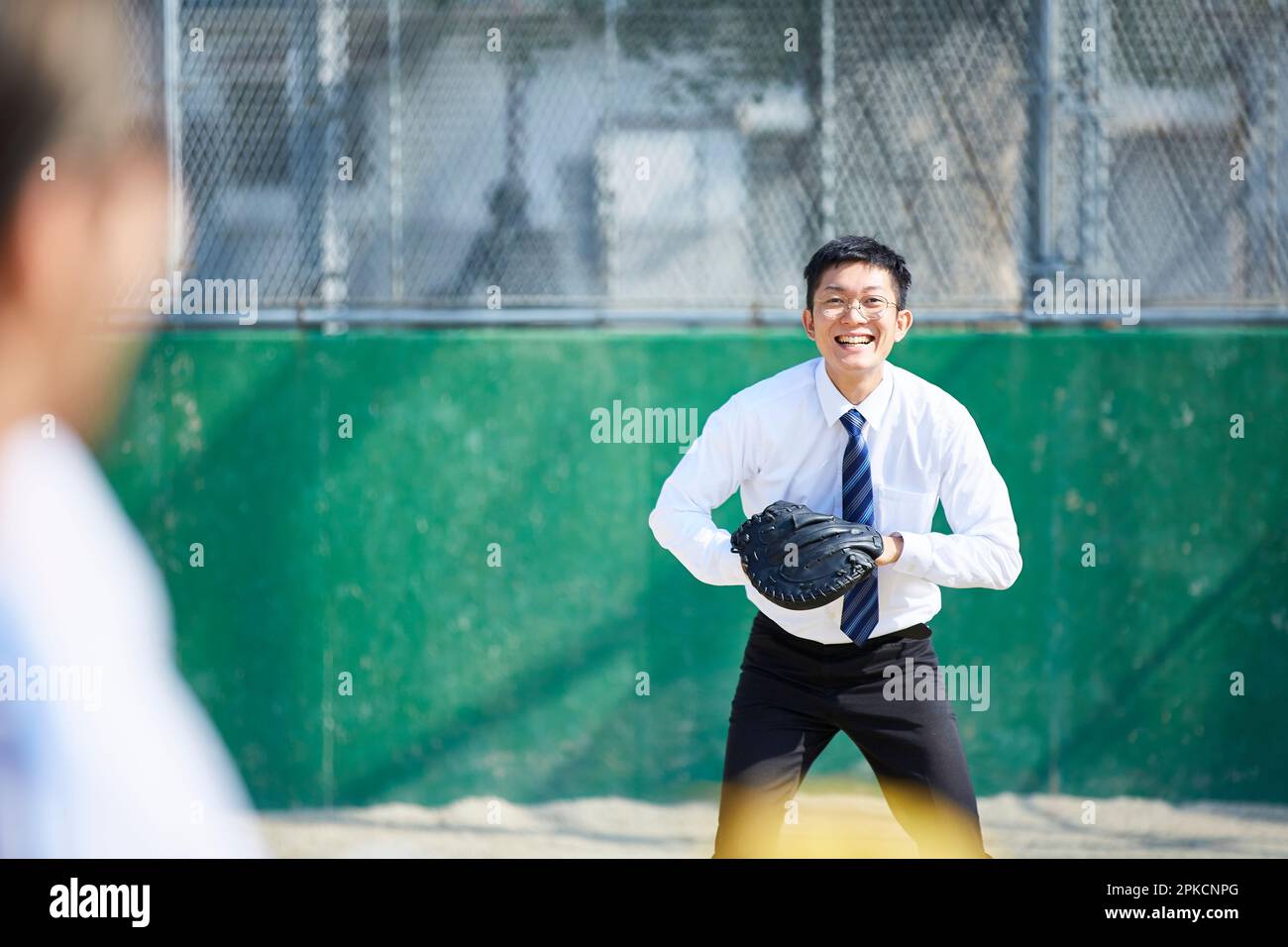 Men in suits playing catch Stock Photo - Alamy