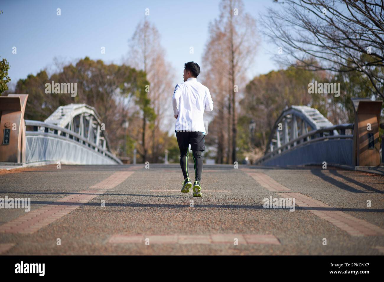 Back view of man running Stock Photo - Alamy