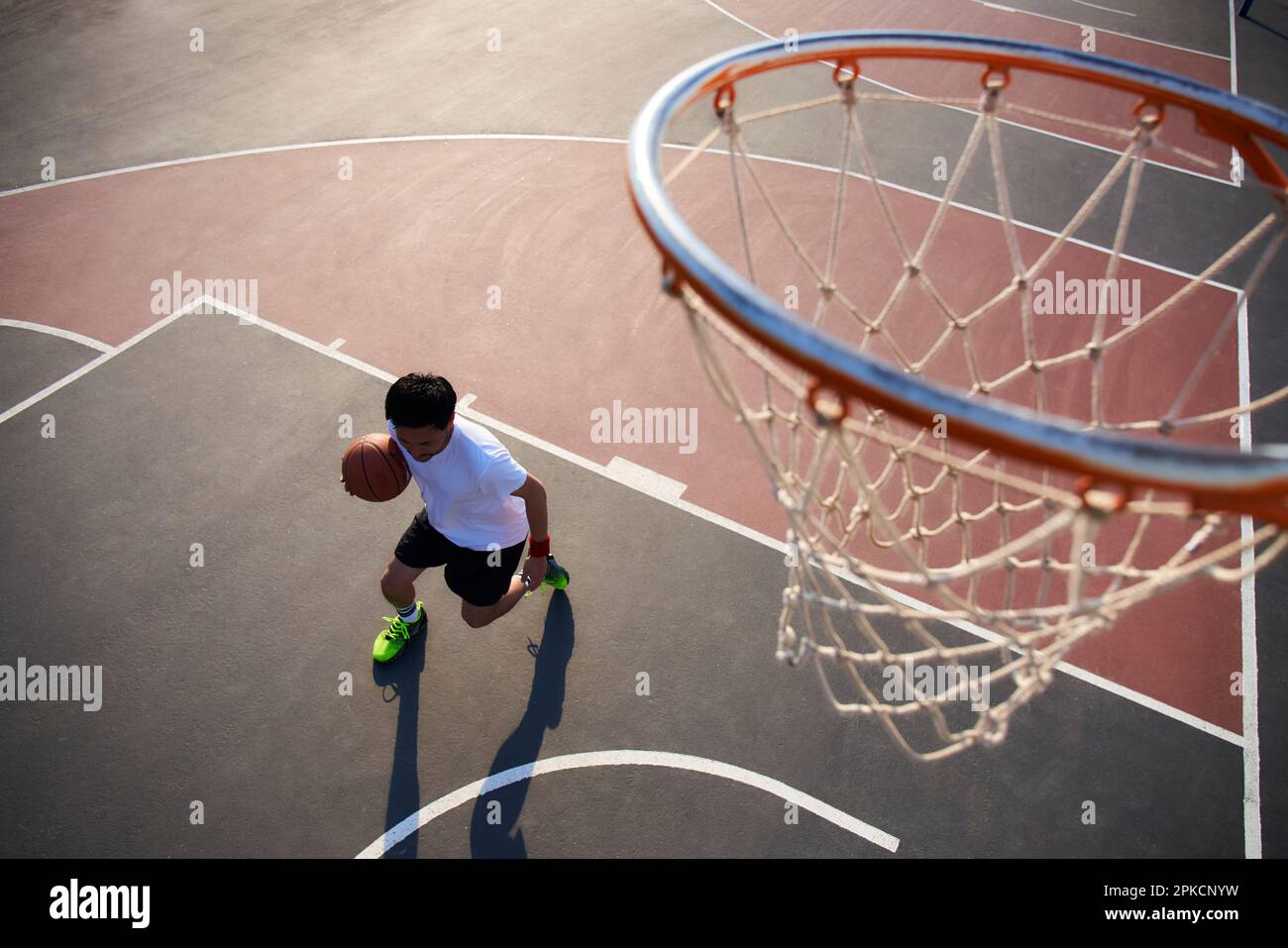 Man Dribbling Under Goal Stock Photo - Alamy