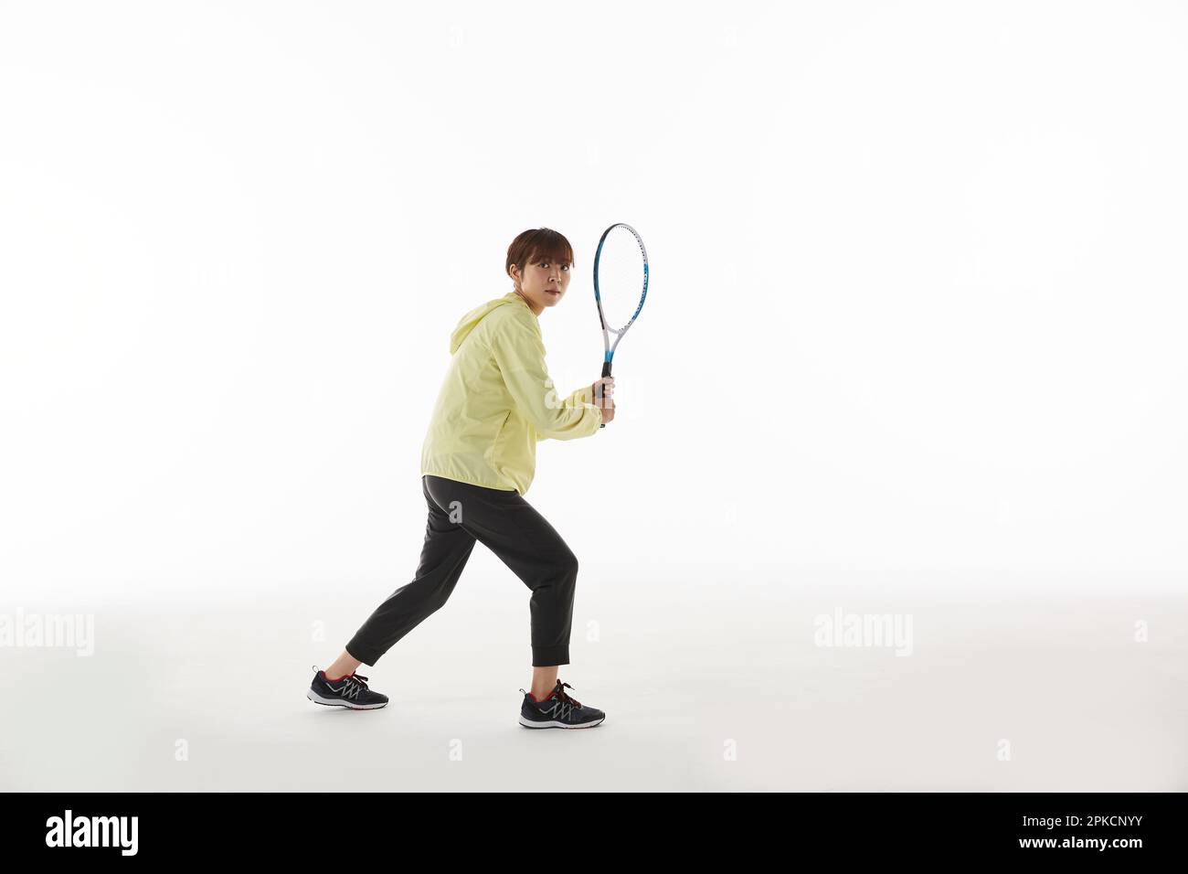 Woman holding a racket Stock Photo - Alamy