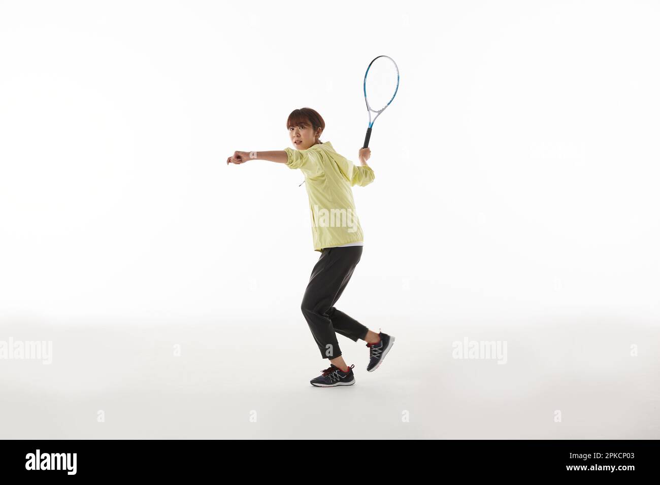 Woman holding racket Stock Photo - Alamy