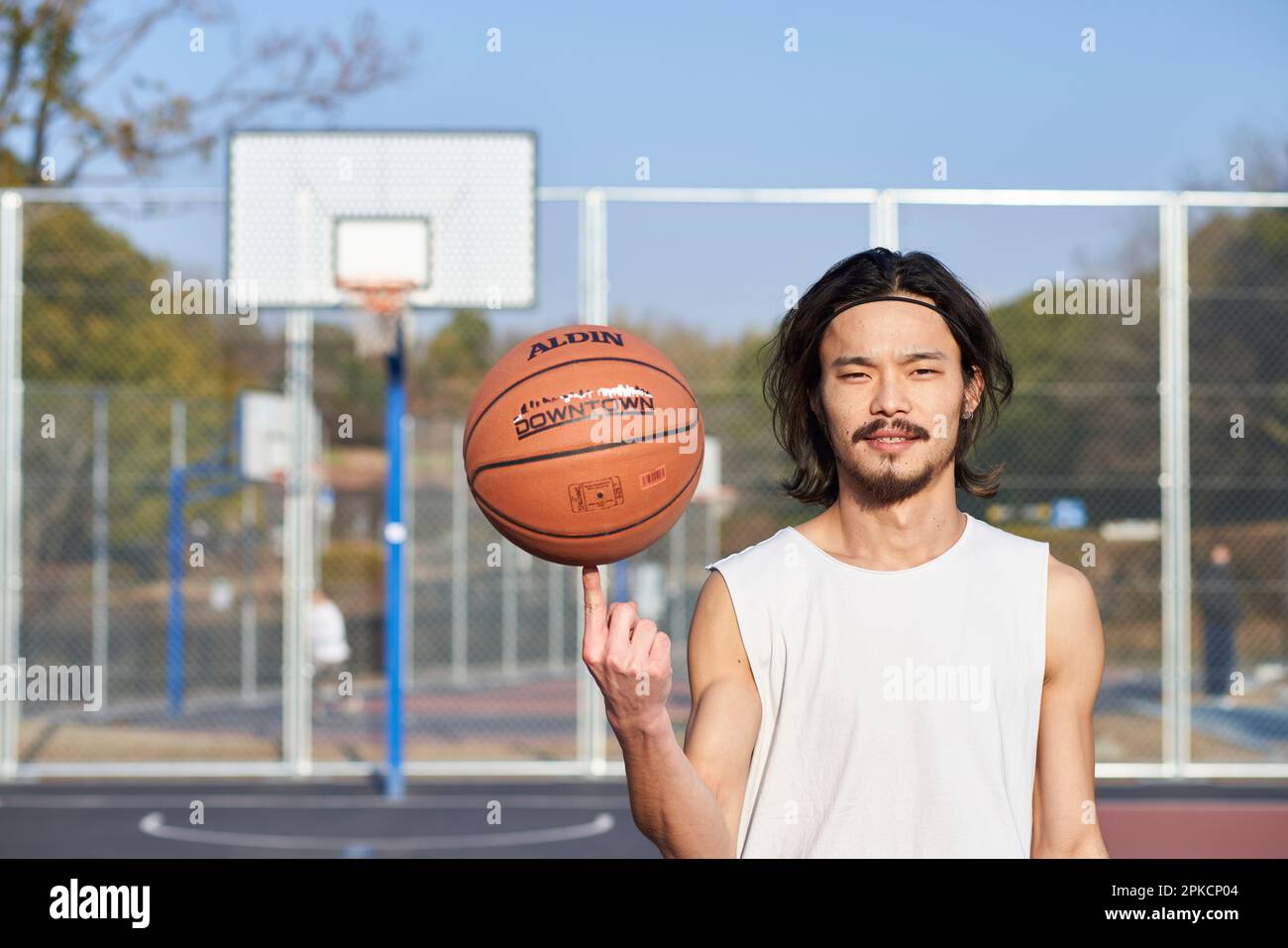 Man placing ball on his fingers Stock Photo - Alamy