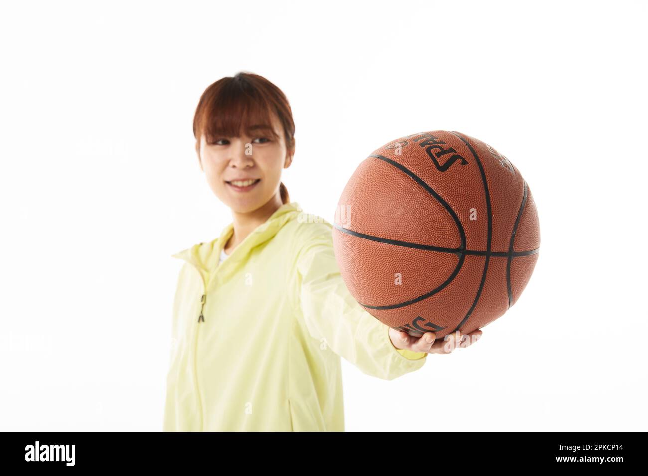 Woman Thrusting Basketball Forward Stock Photo - Alamy