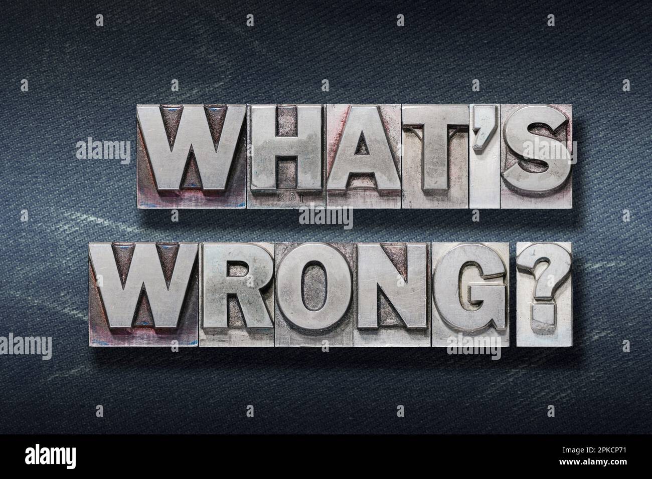 whats wrong question made from metallic letterpress on dark jeans ...