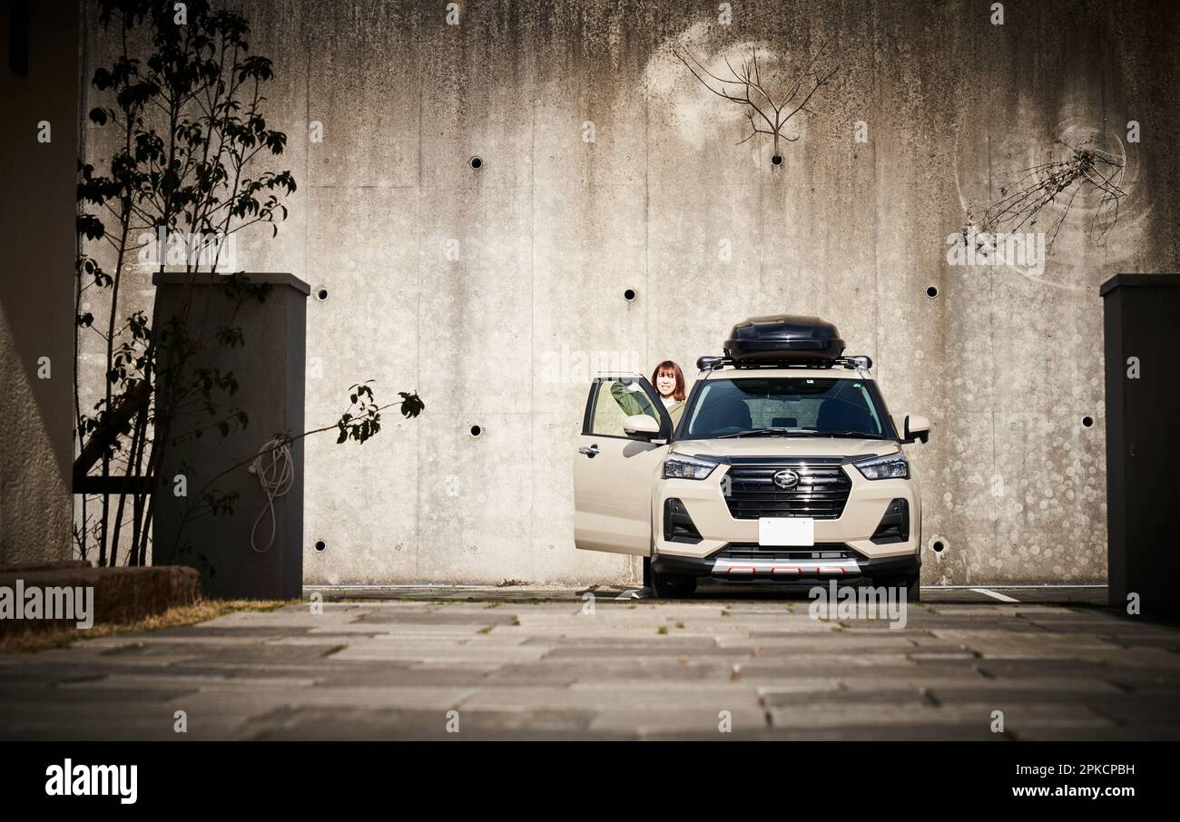 Getting into a car hi-res stock photography and images - Alamy