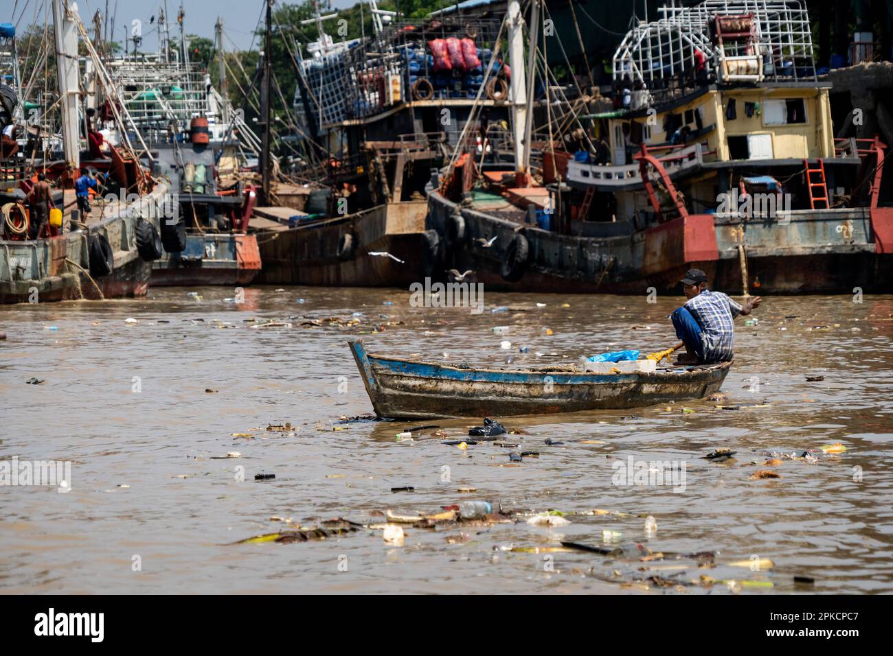 Yangon, Myanmar . 07th Apr, 2023. A trash collector is seen picking ...