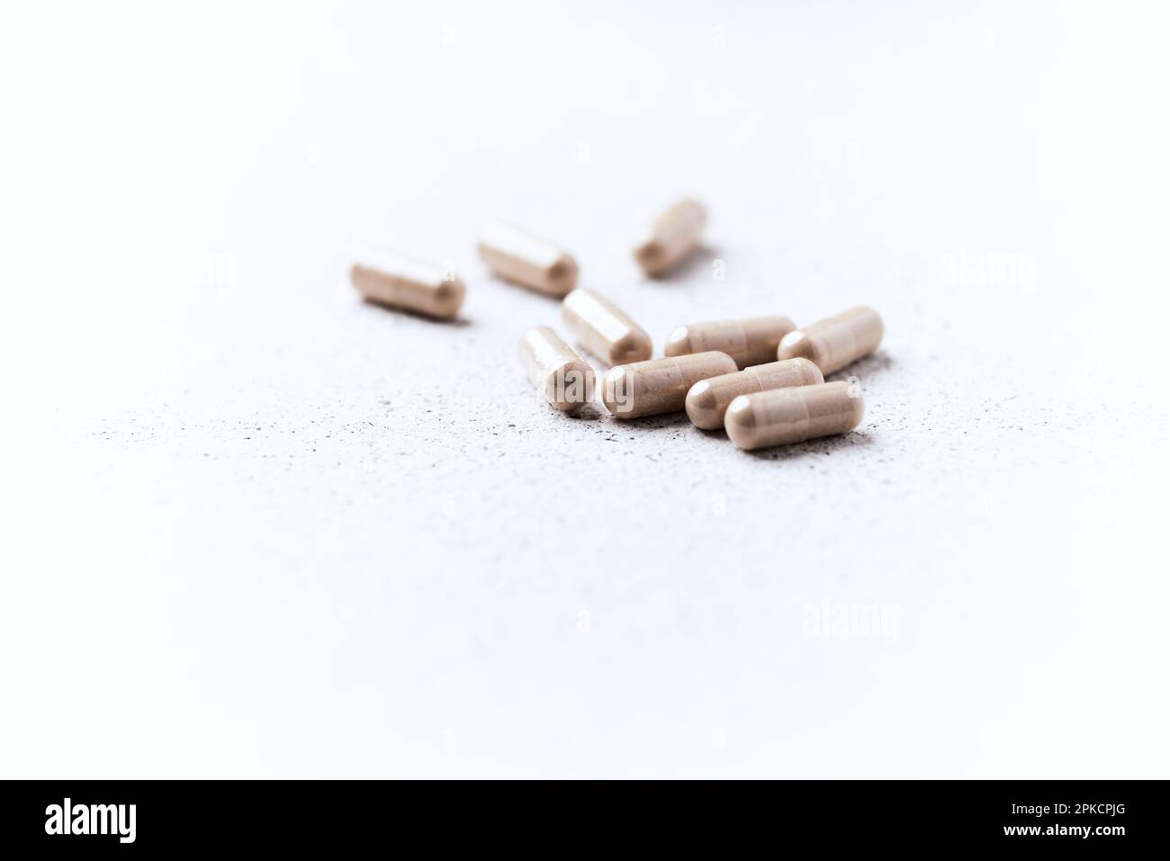 Ashwagandha (Withania somnifera) capsules. Bright paper background ...