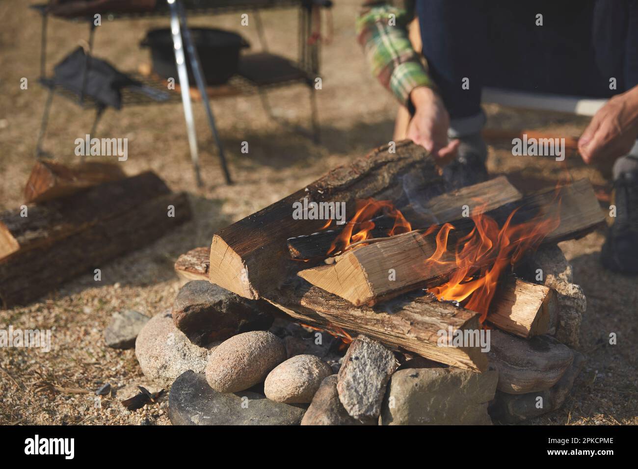 Man making a bonfire Stock Photo - Alamy