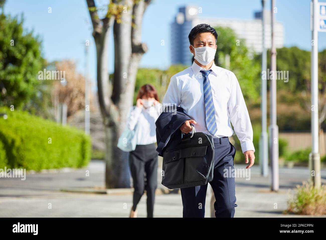 Office workers wearing masks to work Stock Photo - Alamy