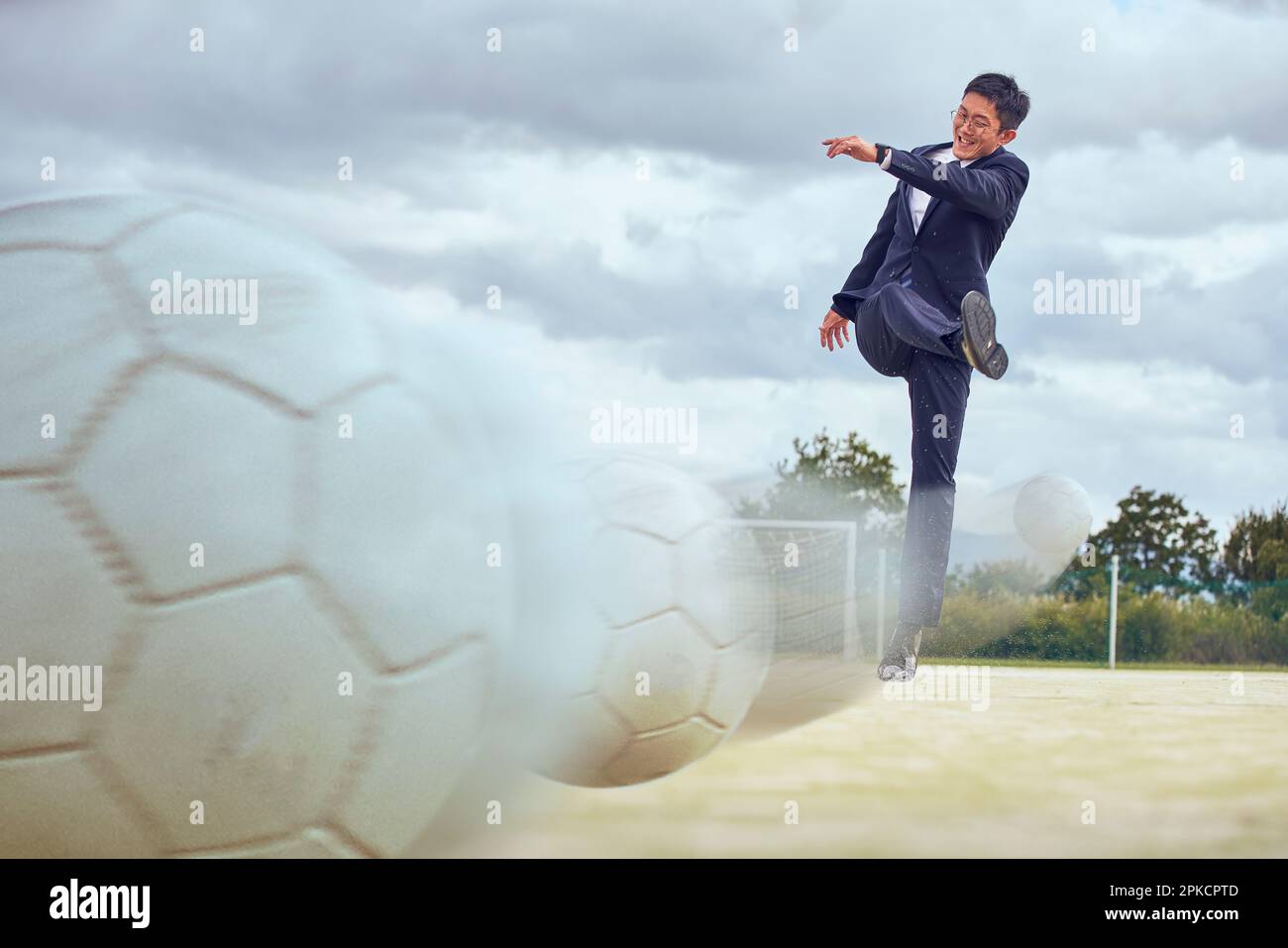 A businessman shooting a ball Stock Photo - Alamy
