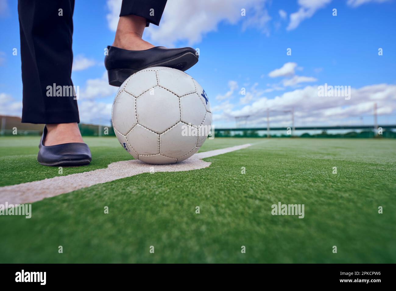 Office worker holding a soccer ball with his foot Stock Photo - Alamy