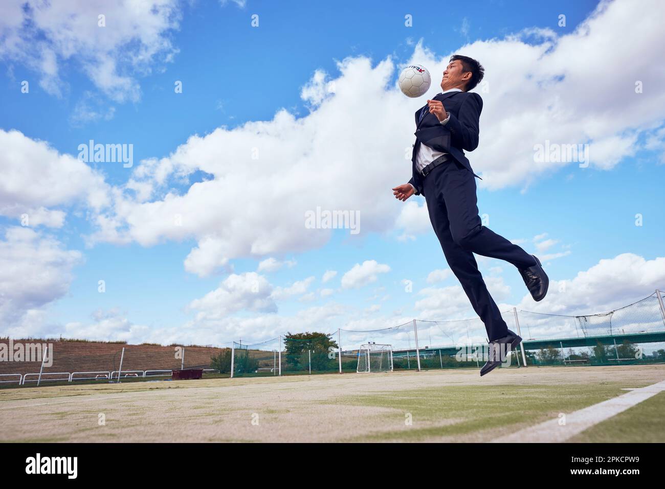 Businessman playing the chest trap Stock Photo - Alamy