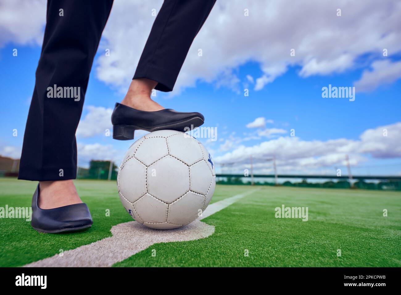 Office worker holding a soccer ball with his foot Stock Photo - Alamy