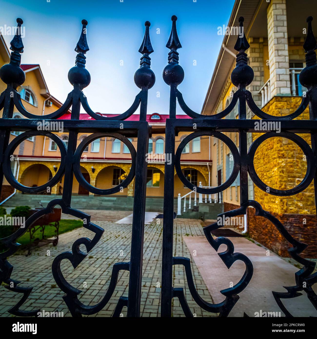 Entrance iron gate to the inner courtyard Stock Photo - Alamy