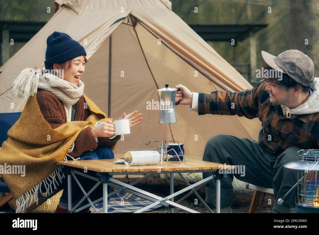 Men and women camping in winter campgrounds Stock Photo - Alamy