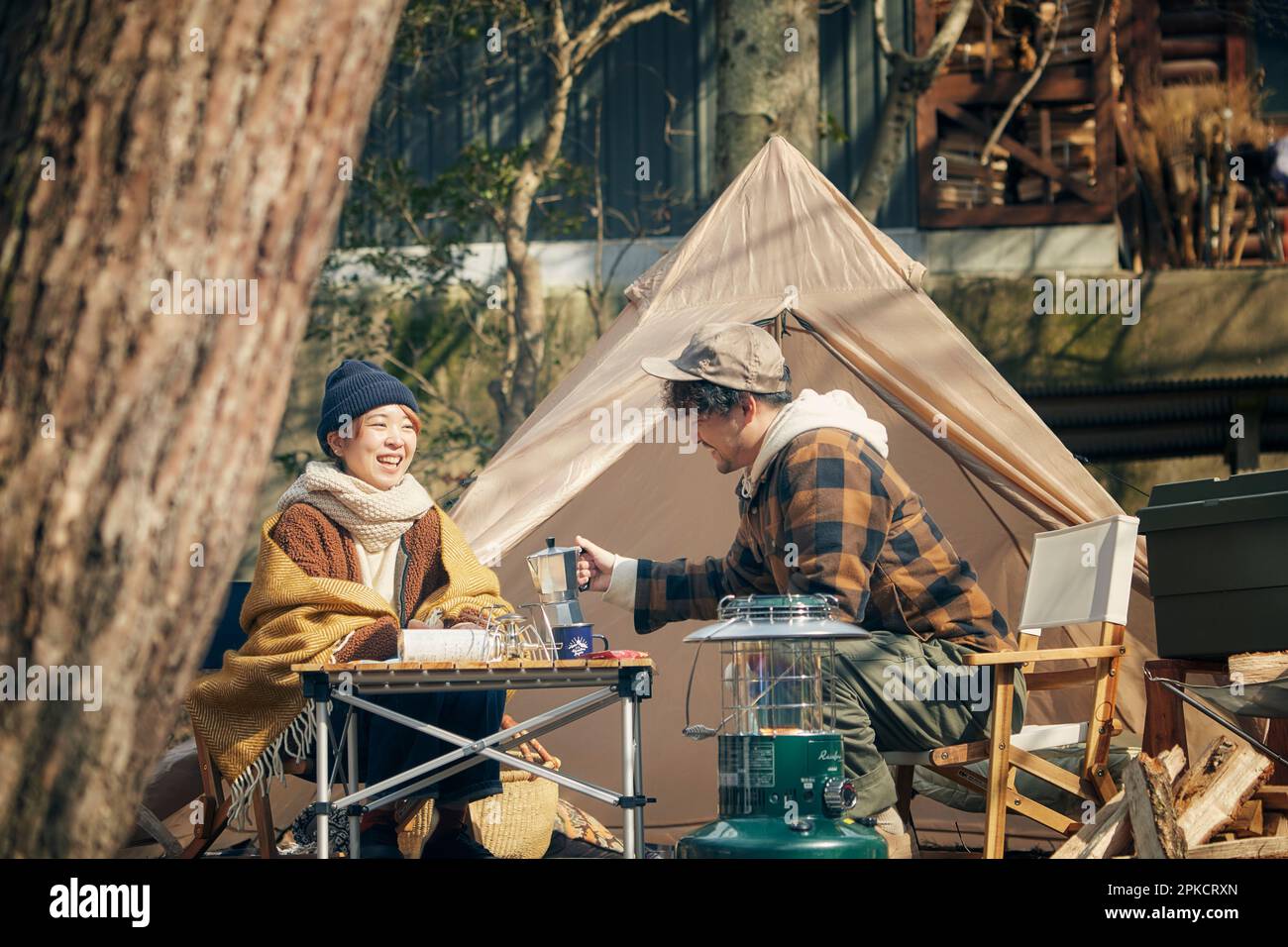 Men and women camping in winter campgrounds Stock Photo - Alamy