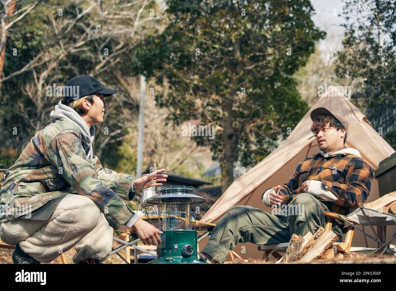Two men camping in a winter campsite Stock Photo - Alamy