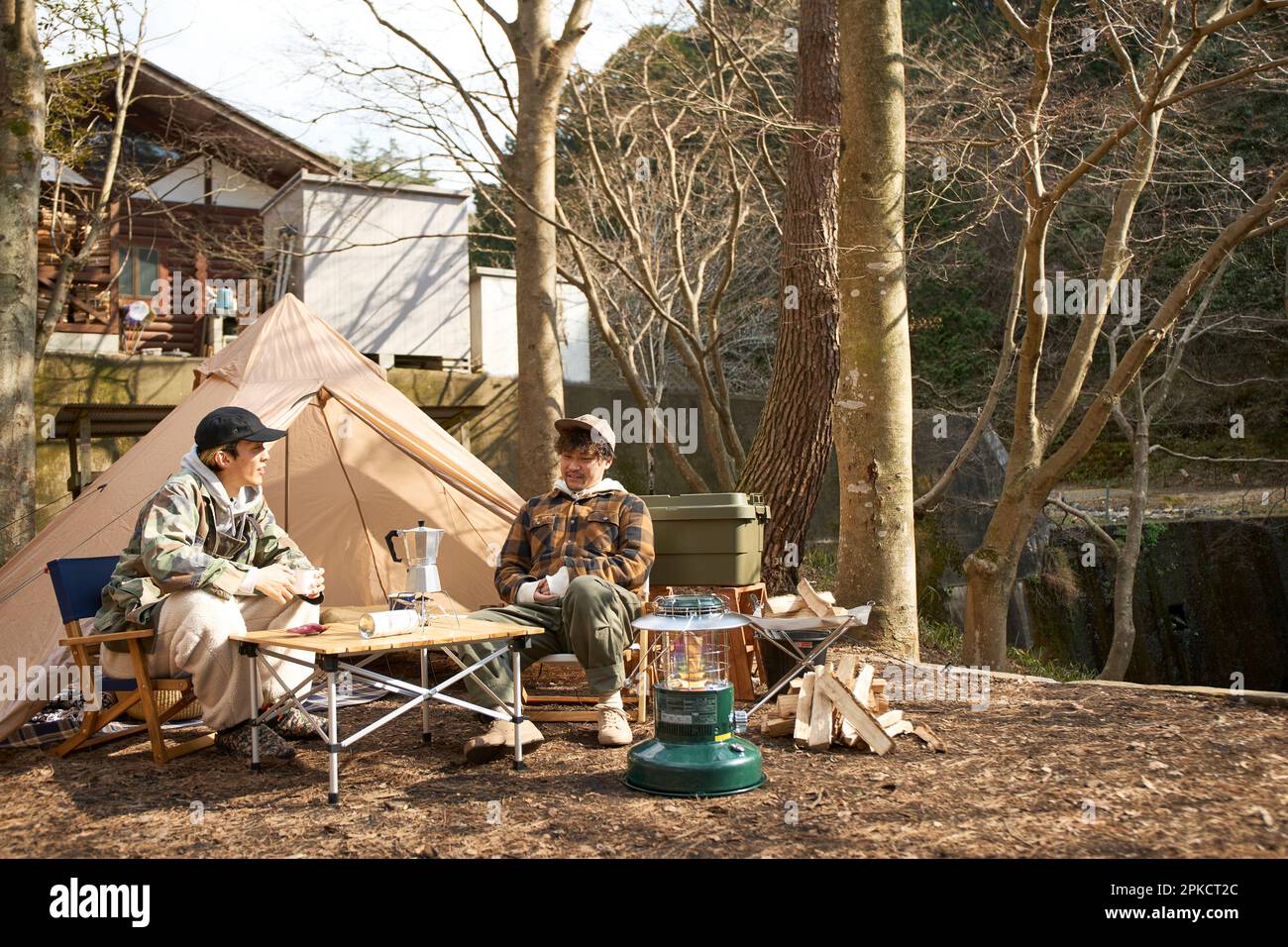 Two men camping at a winter campsite Stock Photo - Alamy