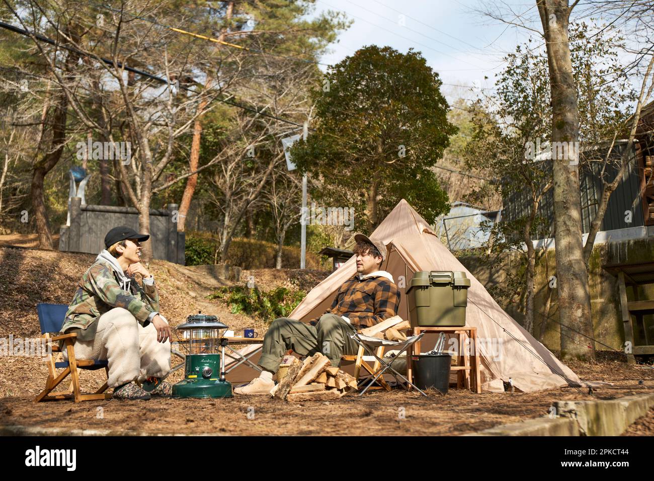 Two men camping in a winter campsite Stock Photo - Alamy
