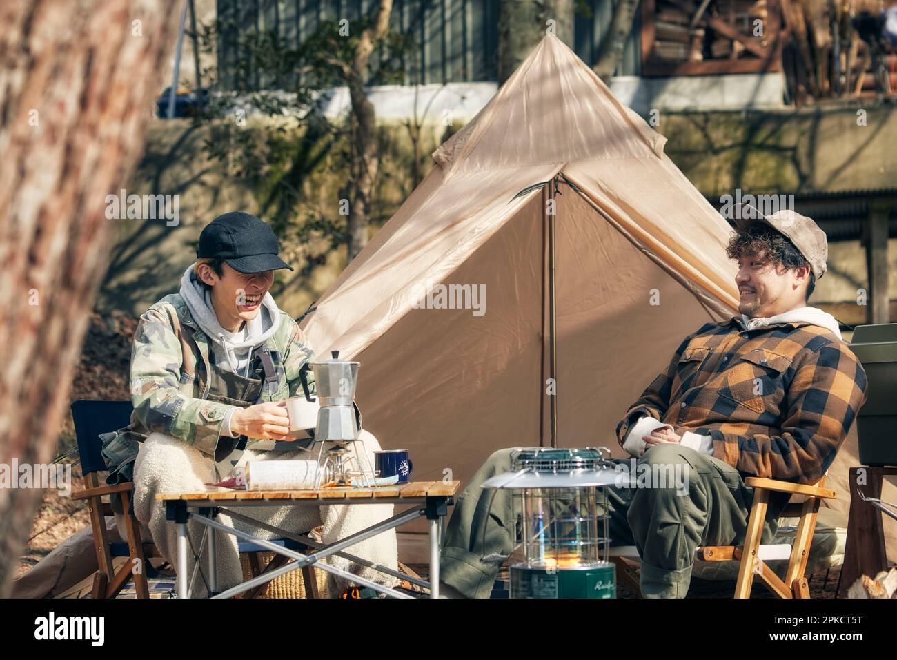 Two men camping in a winter campground Stock Photo - Alamy