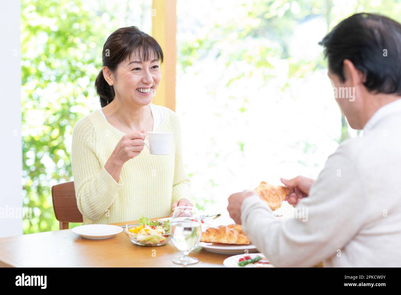 A middle-aged couple eating breakfast Stock Photo - Alamy