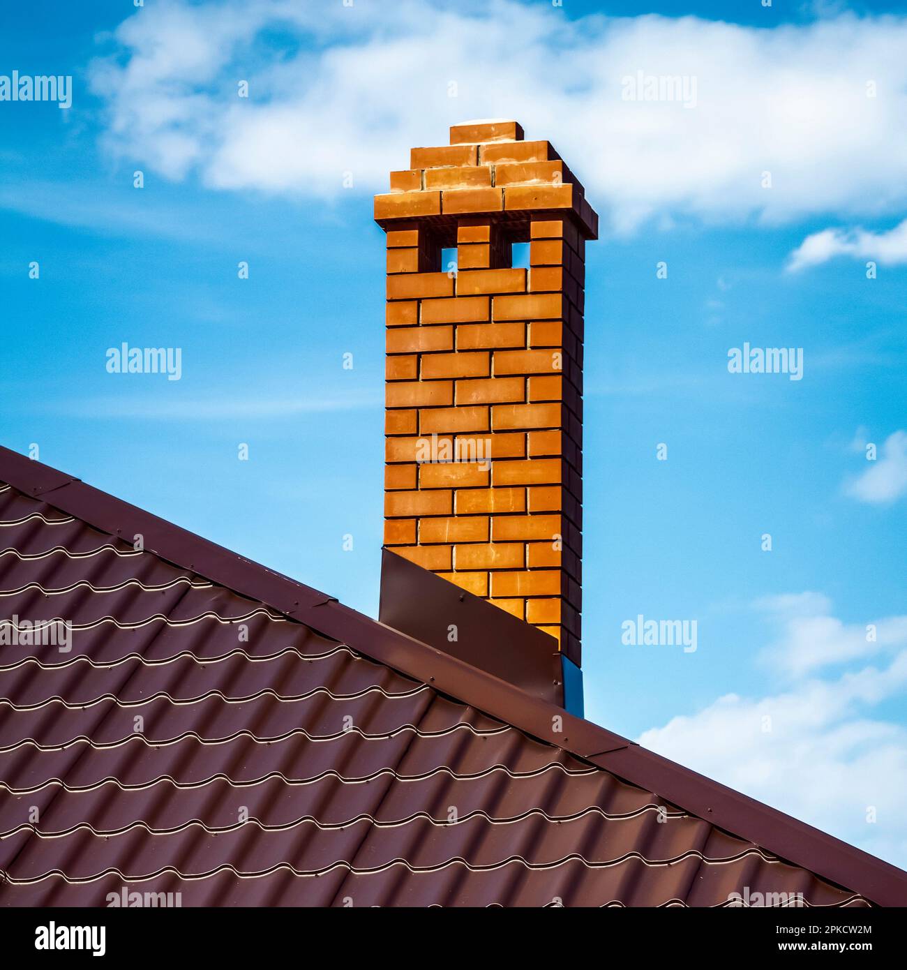 Brick pipe on the roof of a private house Stock Photo - Alamy