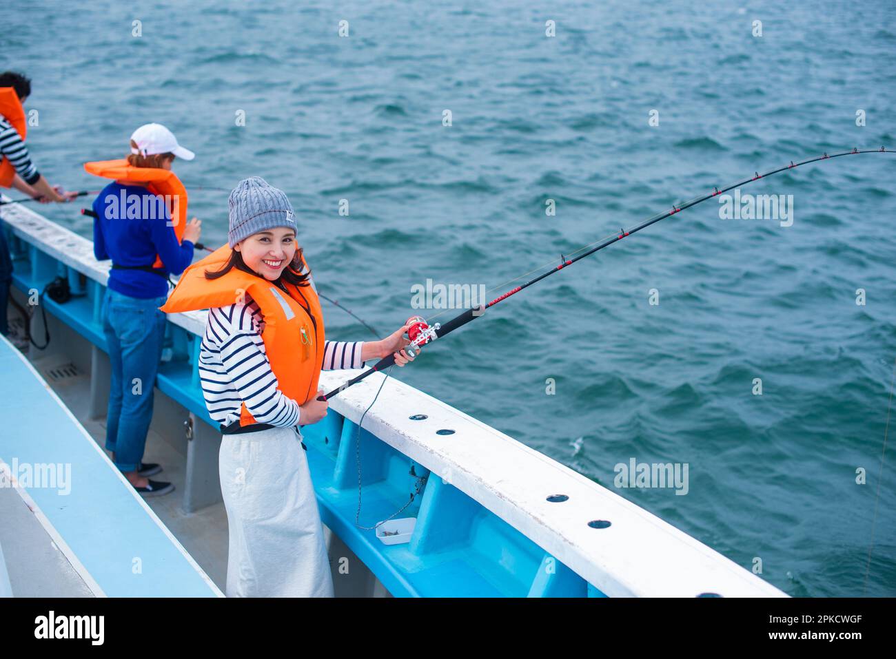Three people fishing hi-res stock photography and images - Alamy