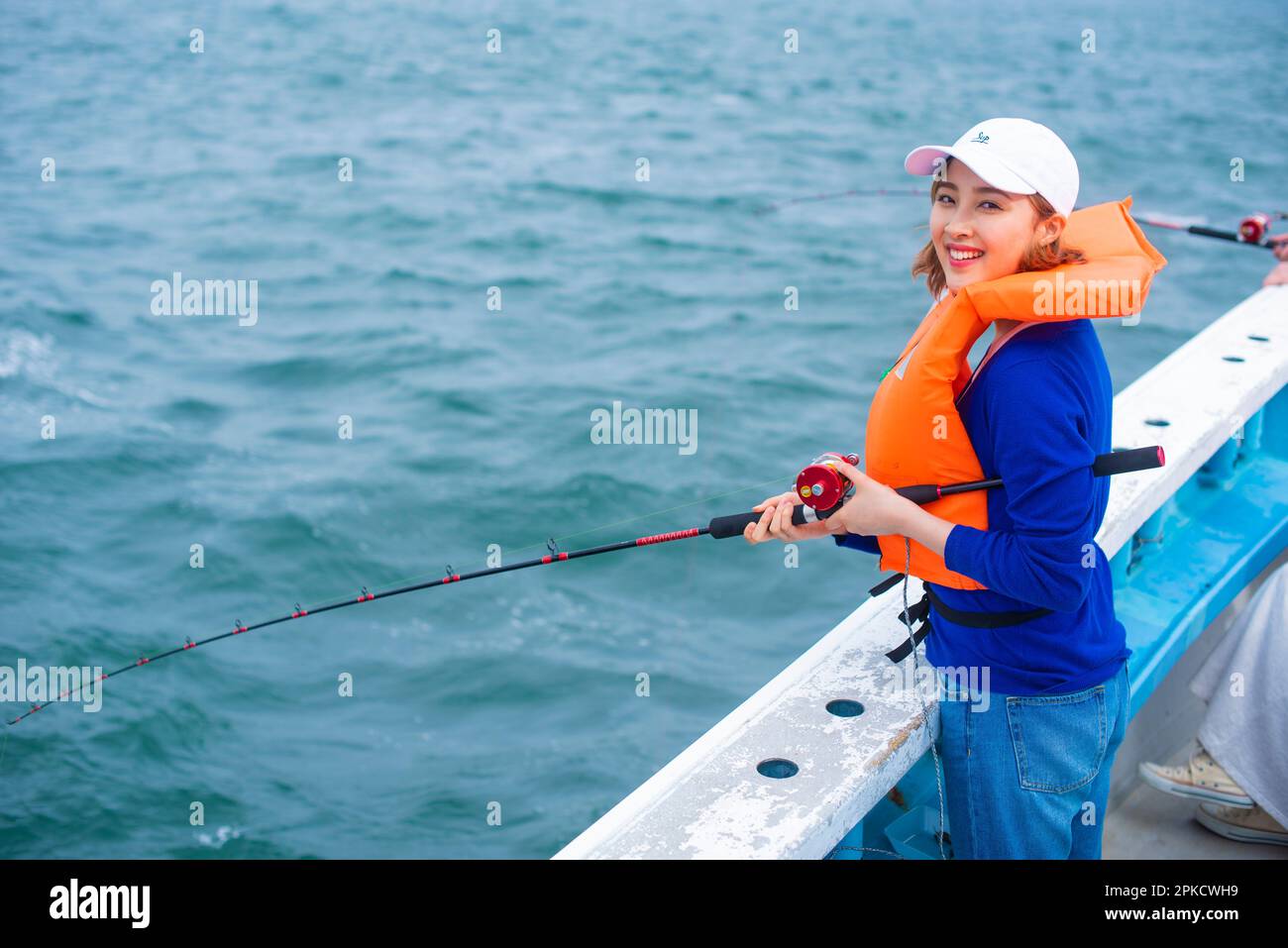 Asian woman fishing hi-res stock photography and images - Alamy
