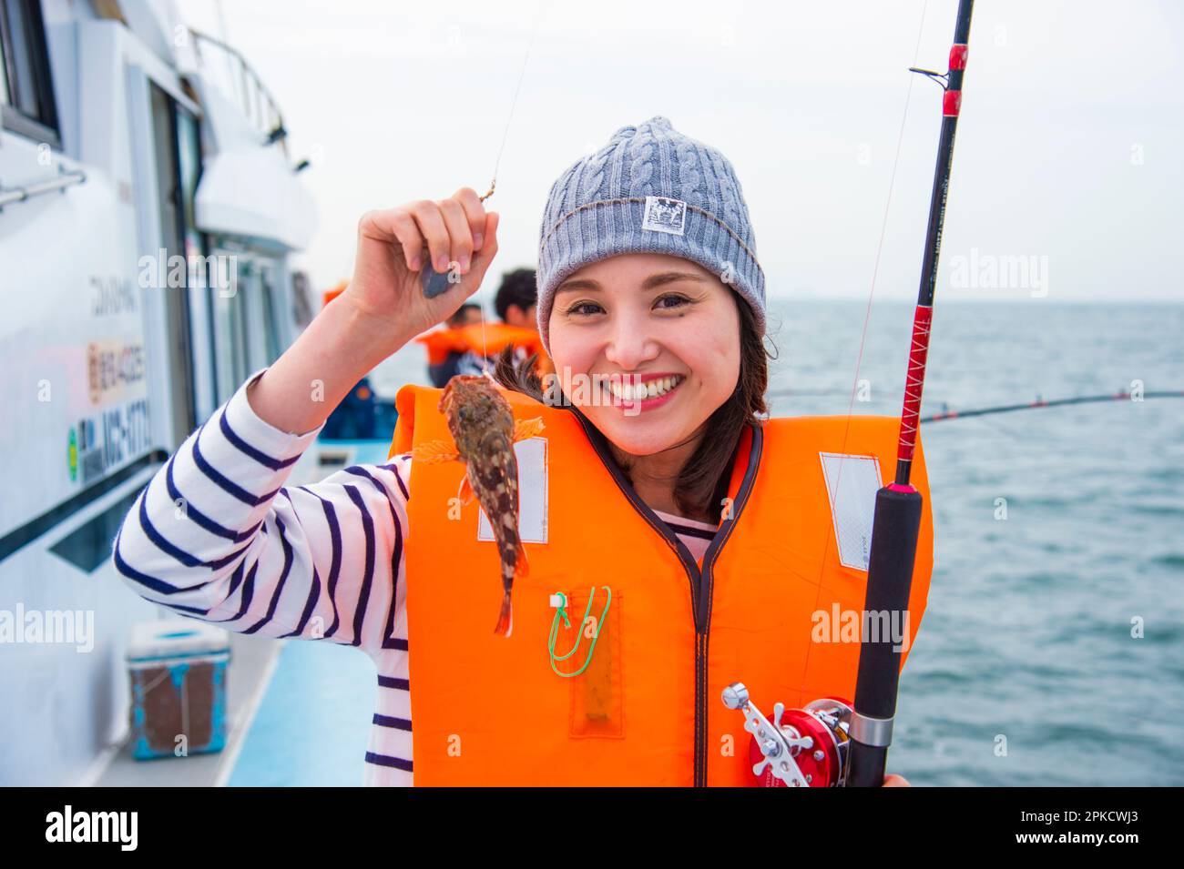 Woman caught fish hi-res stock photography and images - Alamy