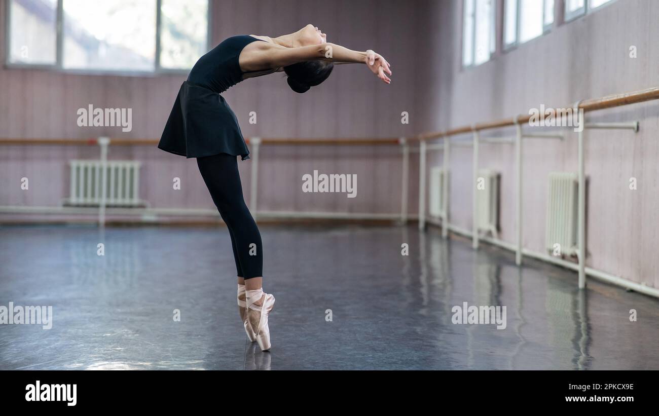 Asian woman dancing in ballet class. Bending in the back Stock Photo ...