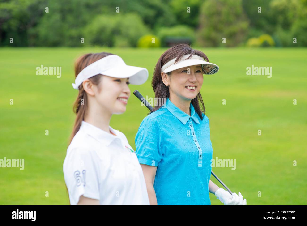 Mother and Daughter Playing Golf Stock Photo - Alamy