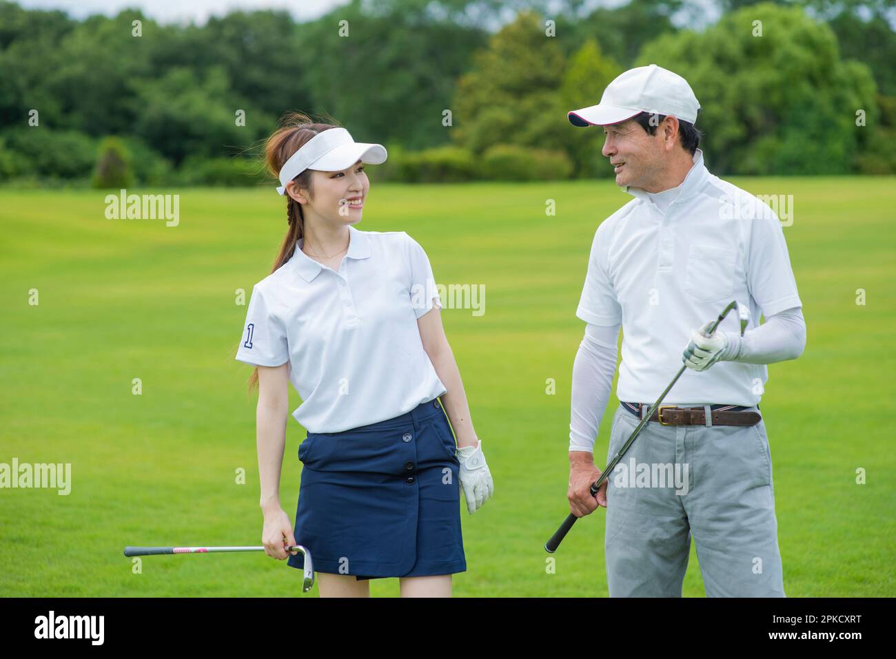 Father and Daughter Playing Golf Stock Photo - Alamy