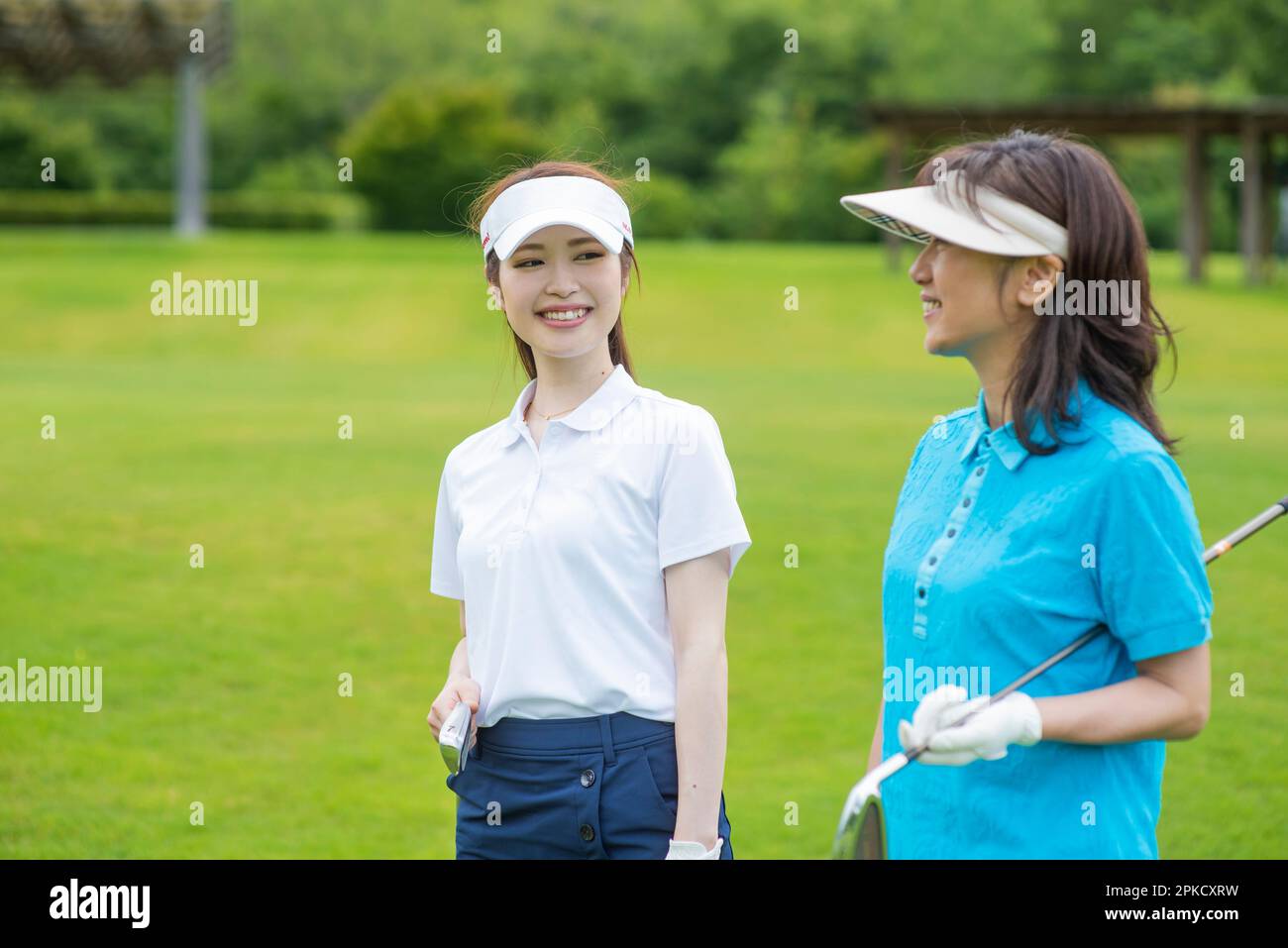Mother and Daughter Playing Golf Stock Photo - Alamy
