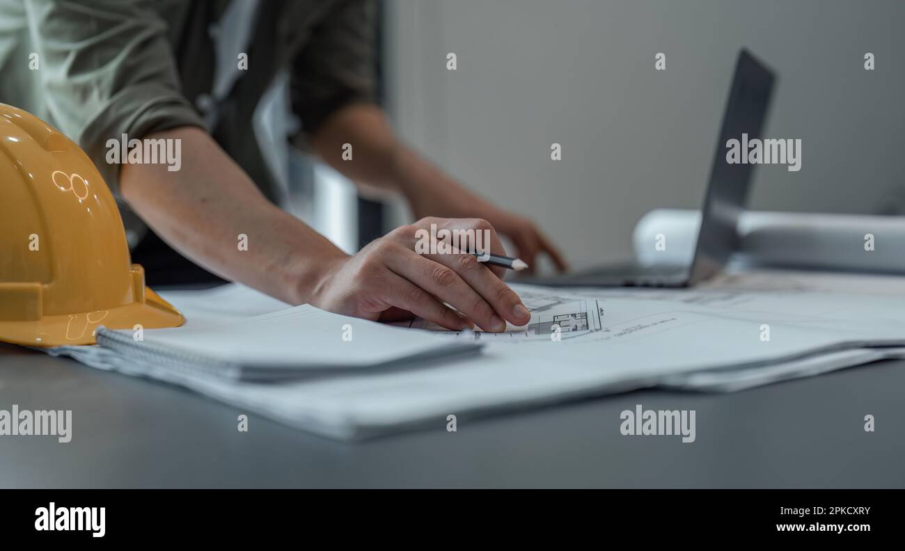 engineer man working in office with blueprints.Engineer inspect ...