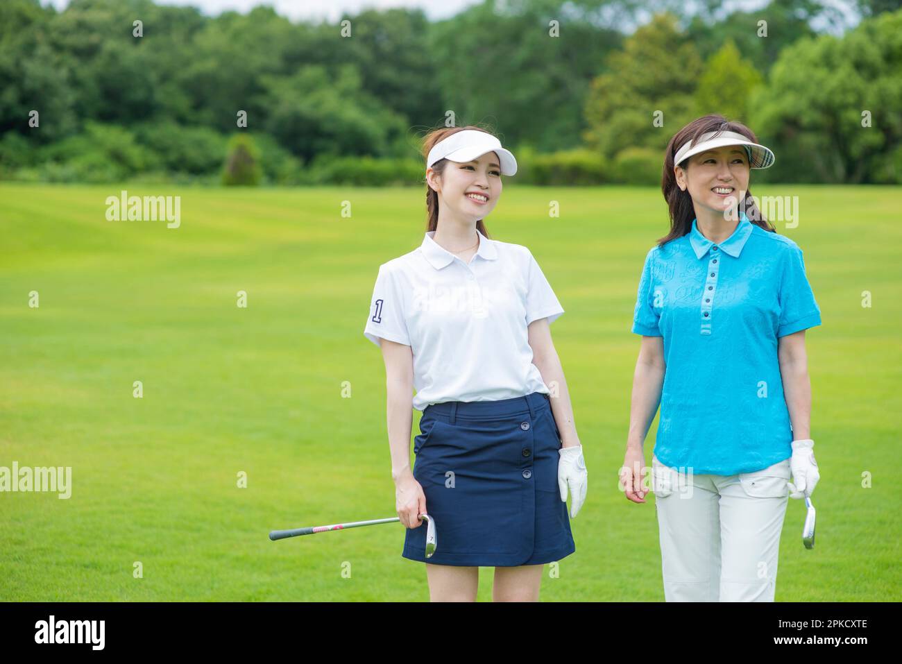 Mother and Daughter Playing Golf Stock Photo - Alamy