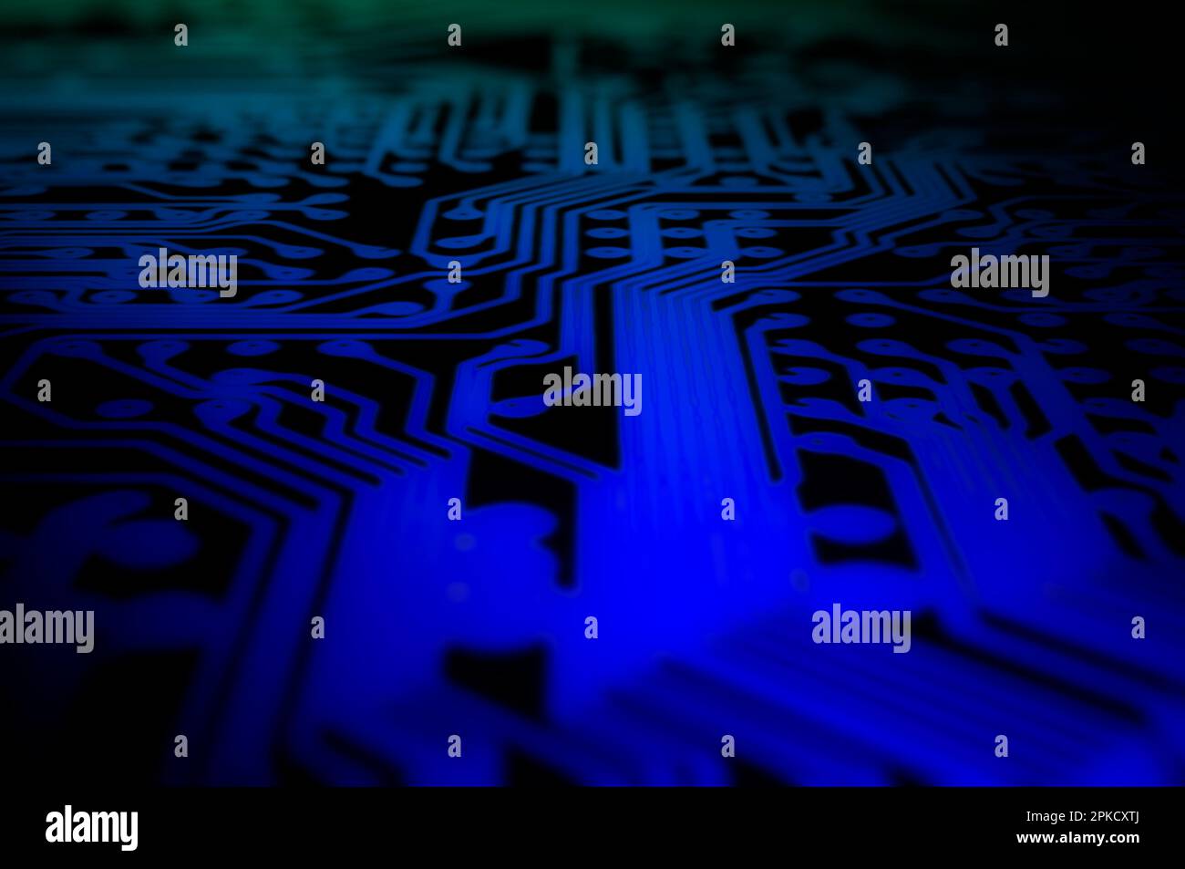 Circuit board close-up illuminated with blue light Stock Photo - Alamy