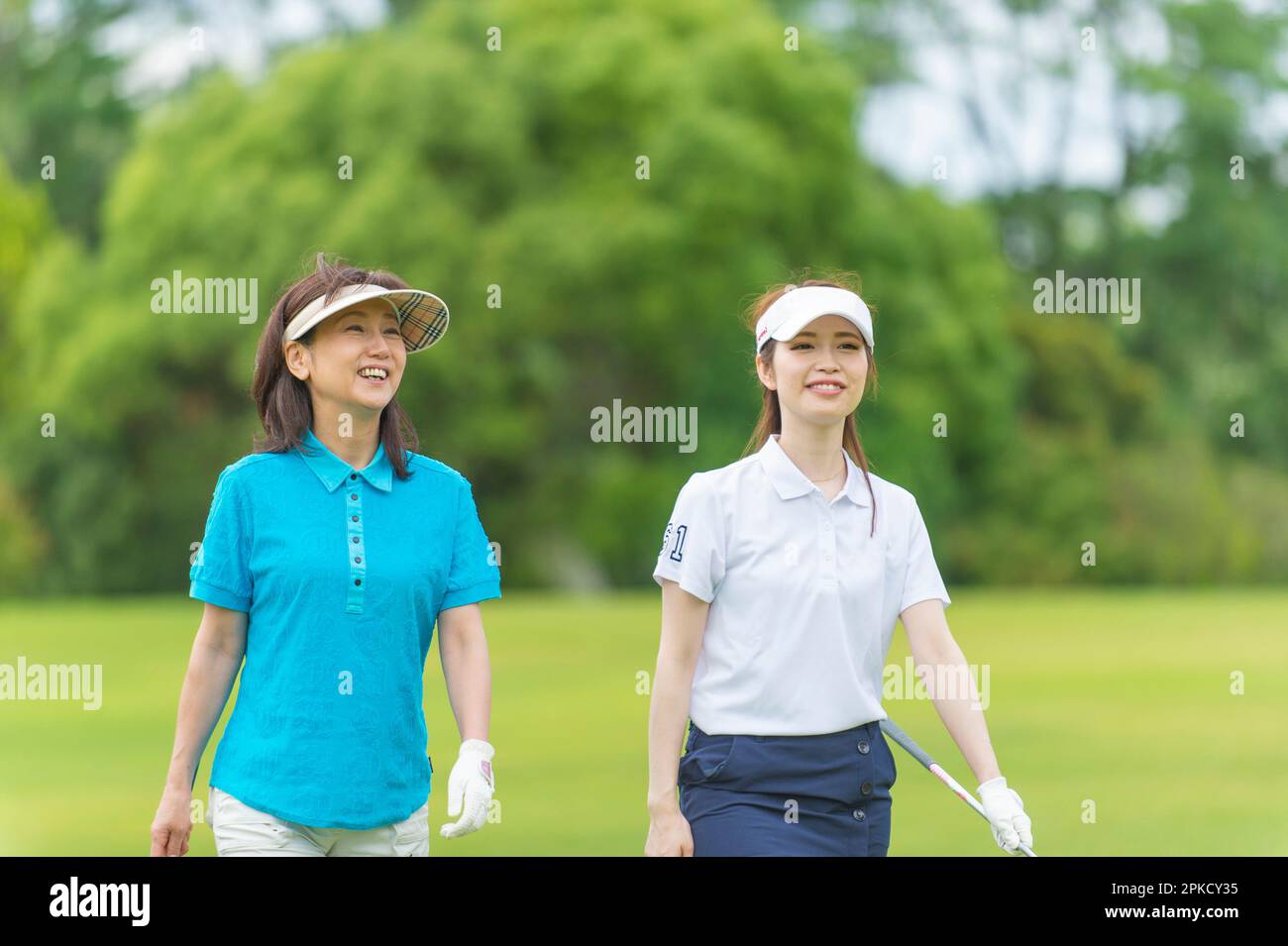 Mother and Daughter Playing Golf Stock Photo - Alamy