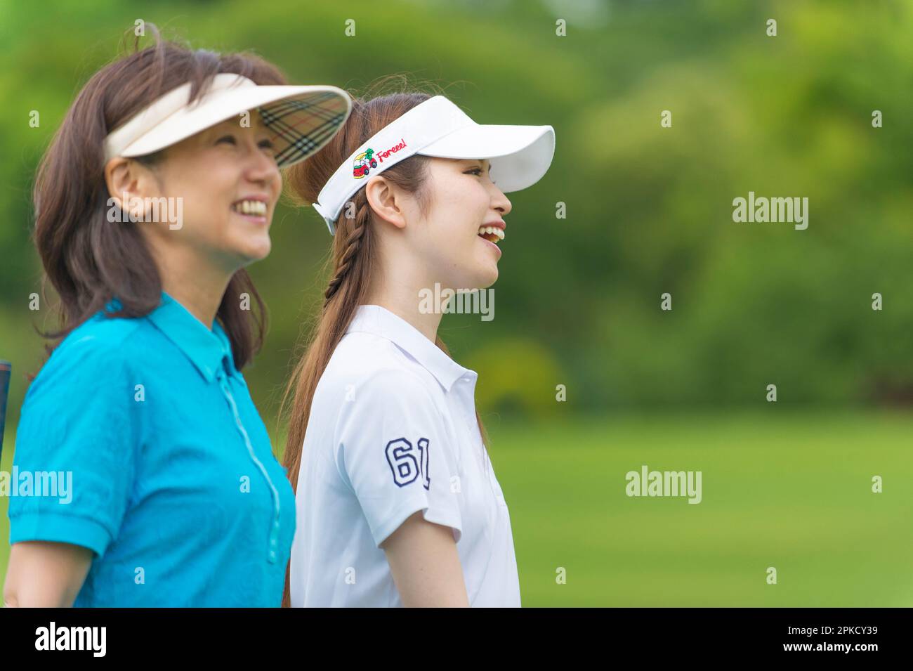 Mother and Daughter Playing Golf Stock Photo - Alamy