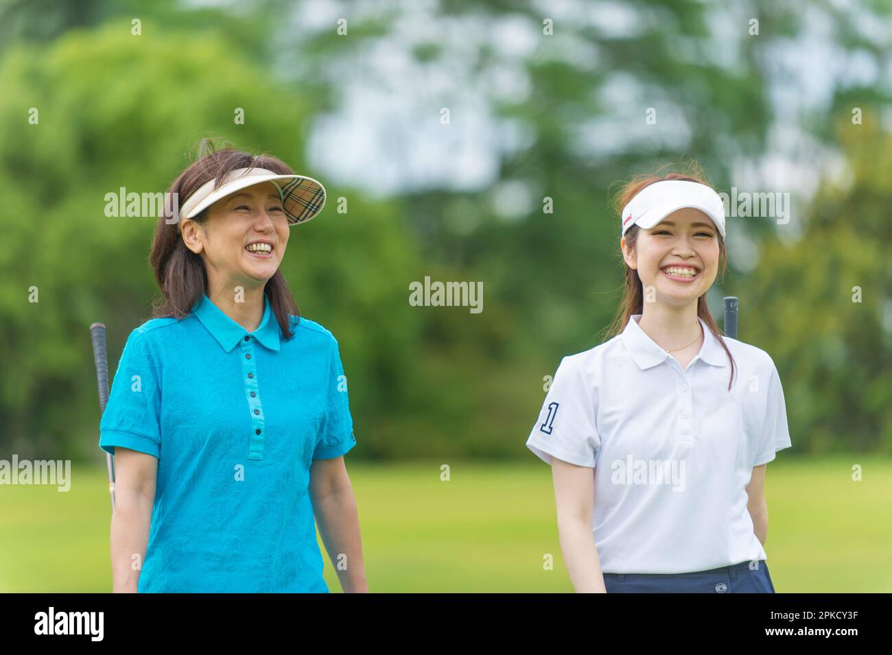 Mother and Daughter Playing Golf Stock Photo - Alamy