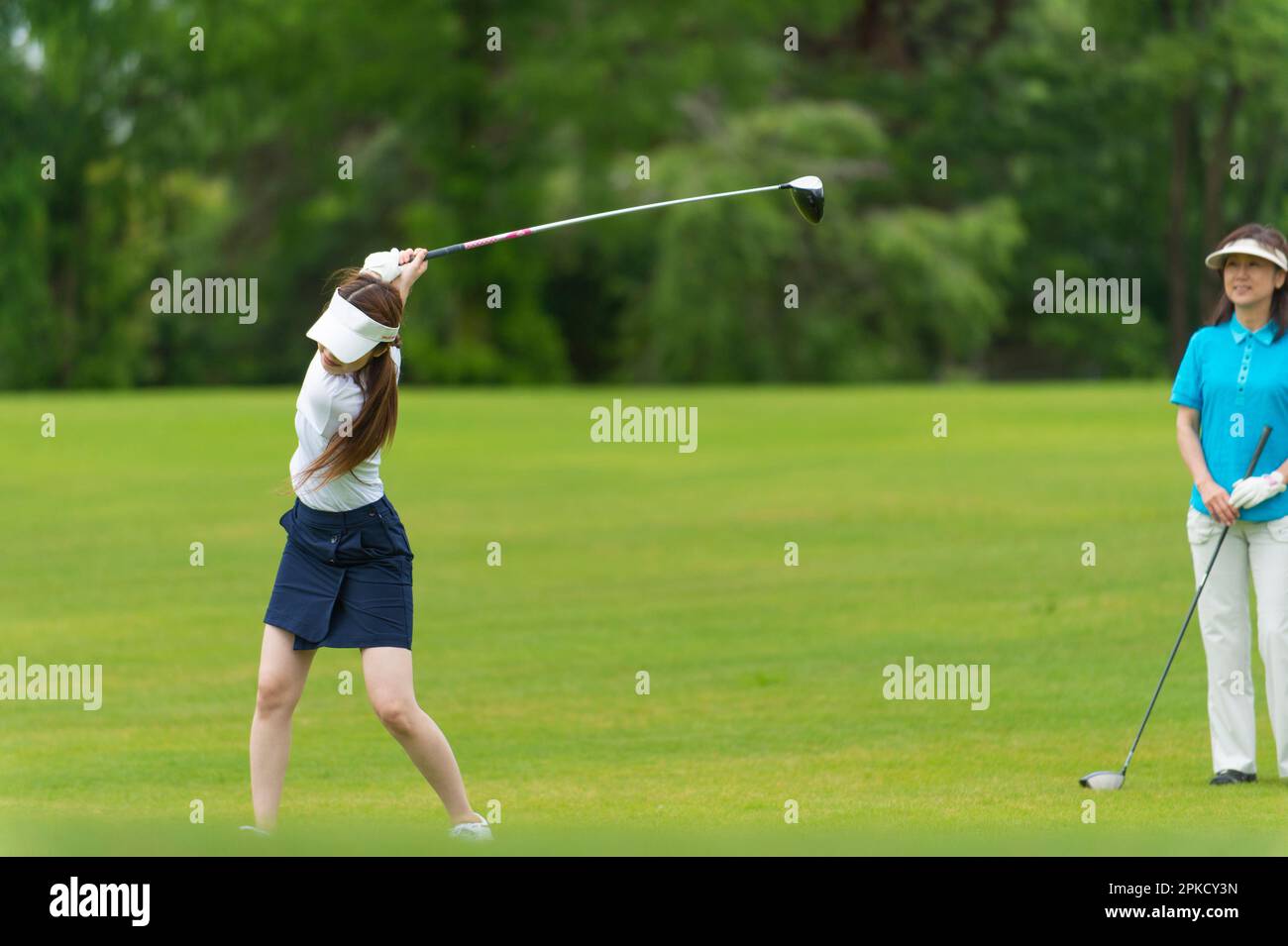 Mother and Daughter Playing Golf Stock Photo - Alamy