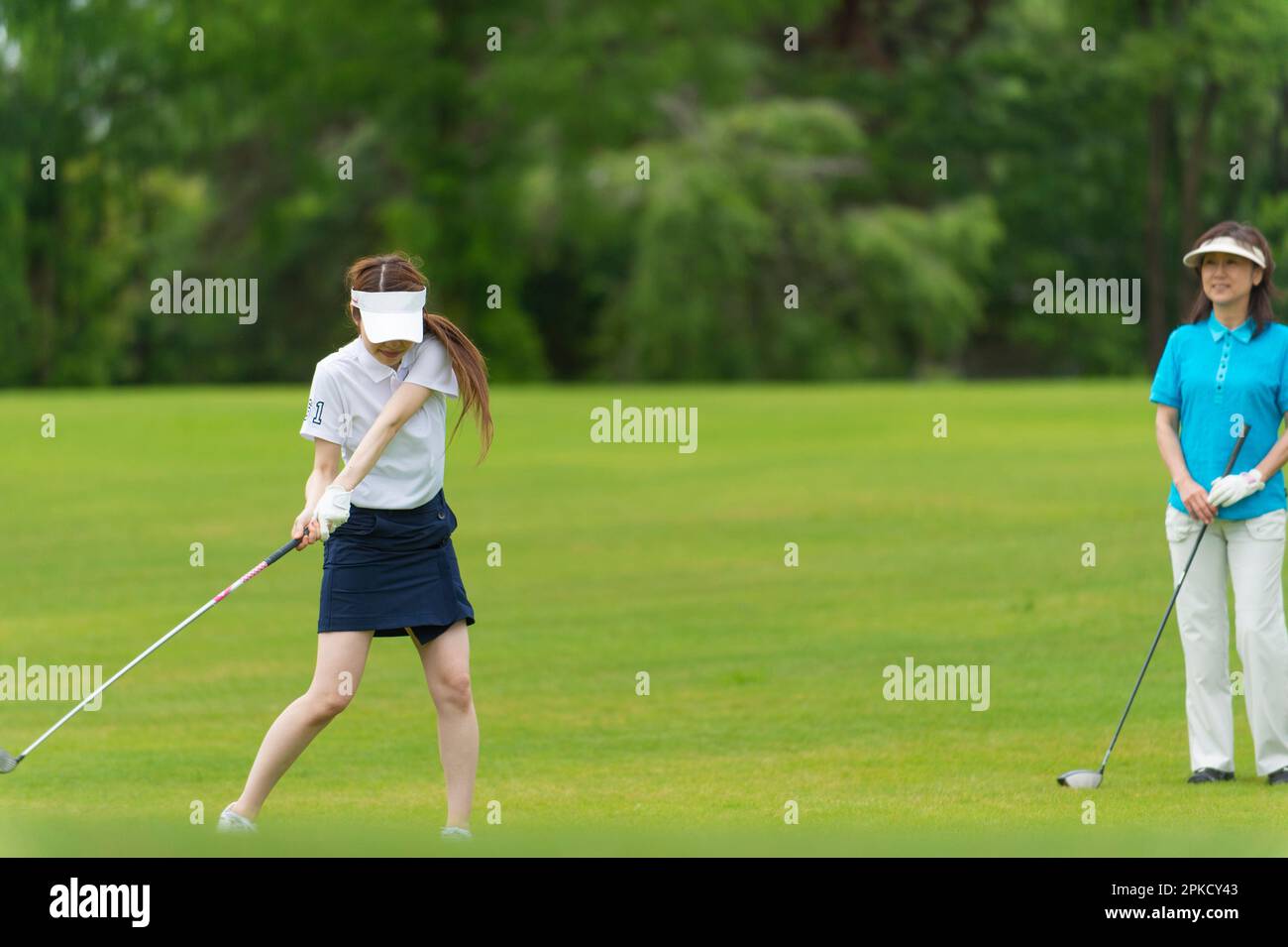 Mother and Daughter Playing Golf Stock Photo - Alamy
