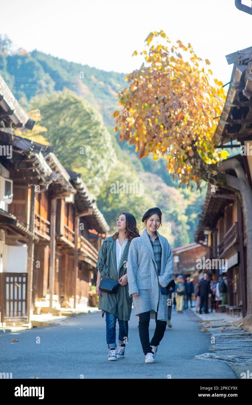 Women walking through town hi-res stock photography and images - Alamy