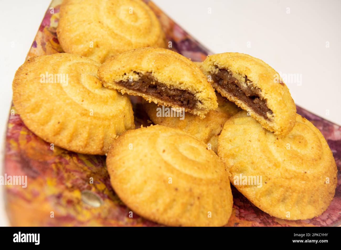 Traditional eid maamoul or mamoul cookies with dates, nuts, and jam ...
