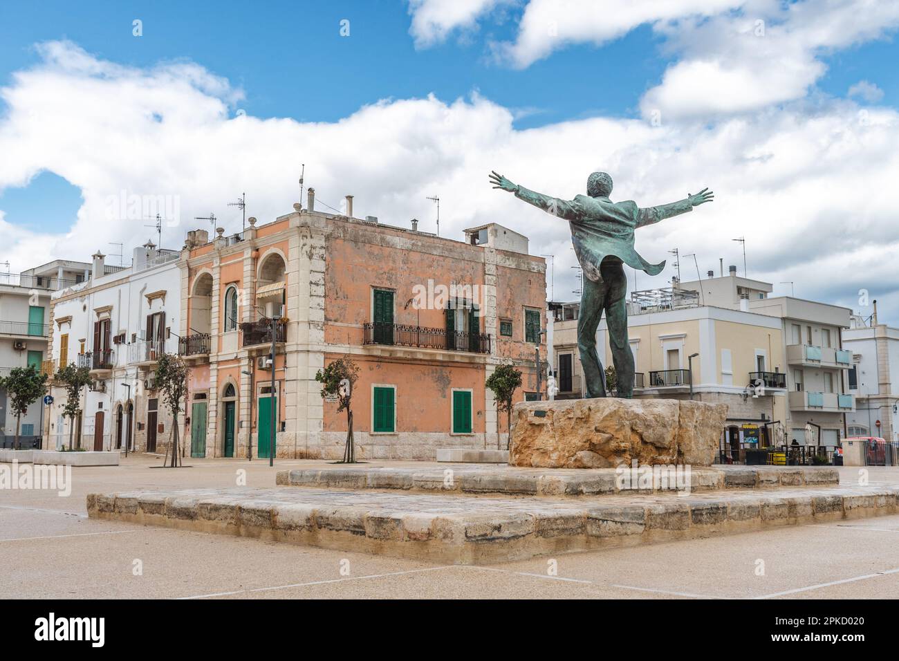 Bronze statue of the Italian singer Domenico Modugno facing the old ...