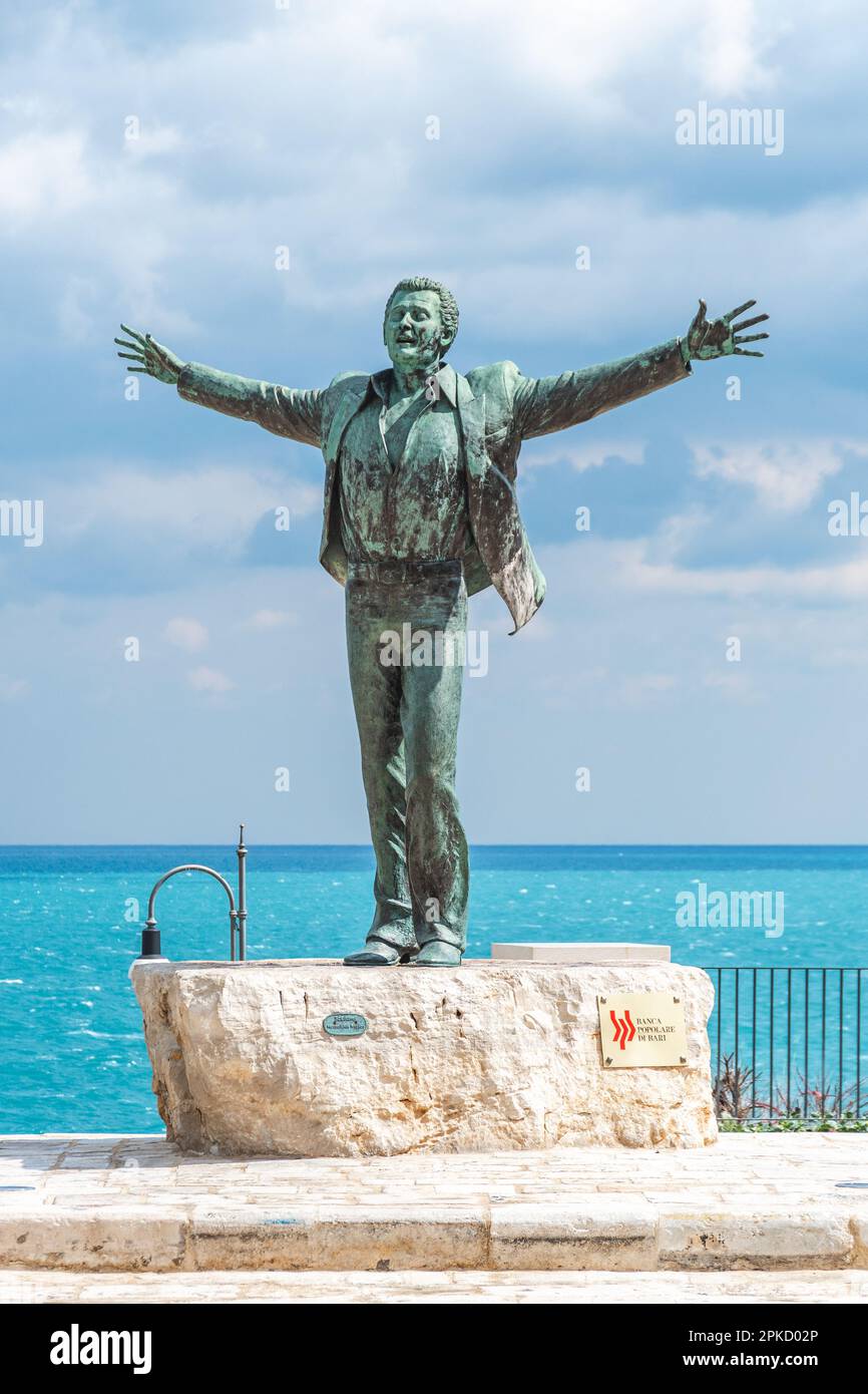 Bronze statue of the Italian singer Domenico Modugno facing the old ...