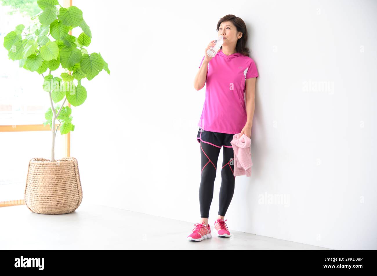 Middle-aged women who take a rest after exercise Stock Photo - Alamy