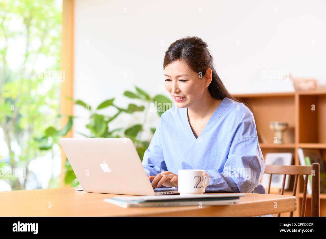 Two middle-aged women teleworking Stock Photo - Alamy